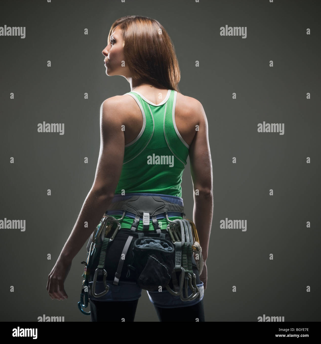 Back view of woman with climbing gear Stock Photo - Alamy
