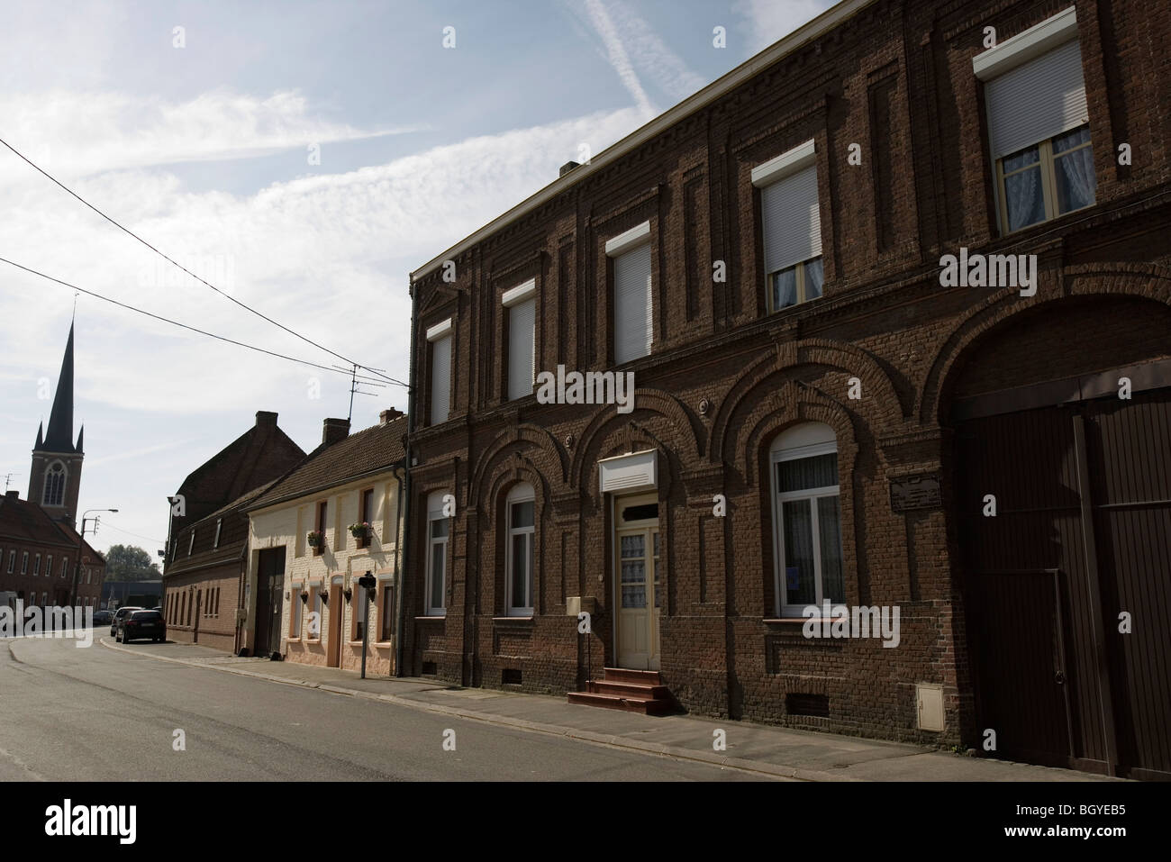 Village street, church in background Stock Photo - Alamy