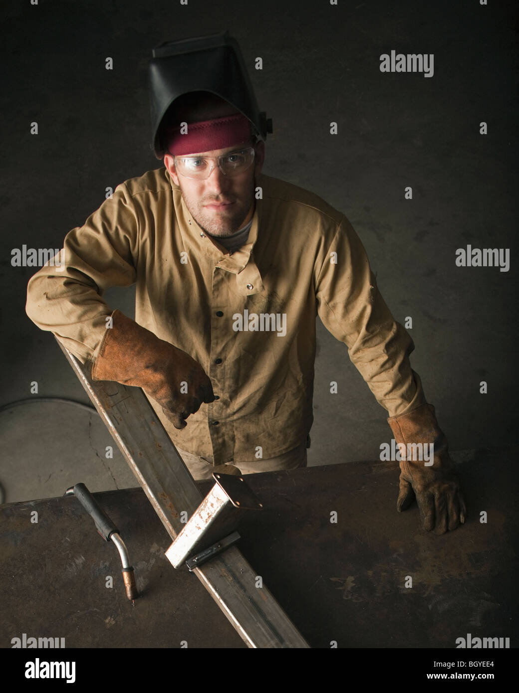 Steel worker in metal shop Stock Photo - Alamy