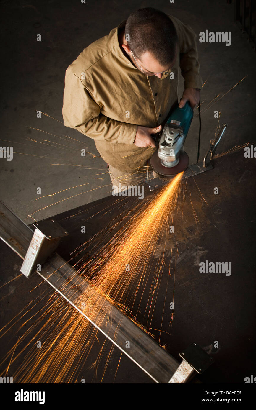 Steel worker in metal shop Stock Photo - Alamy