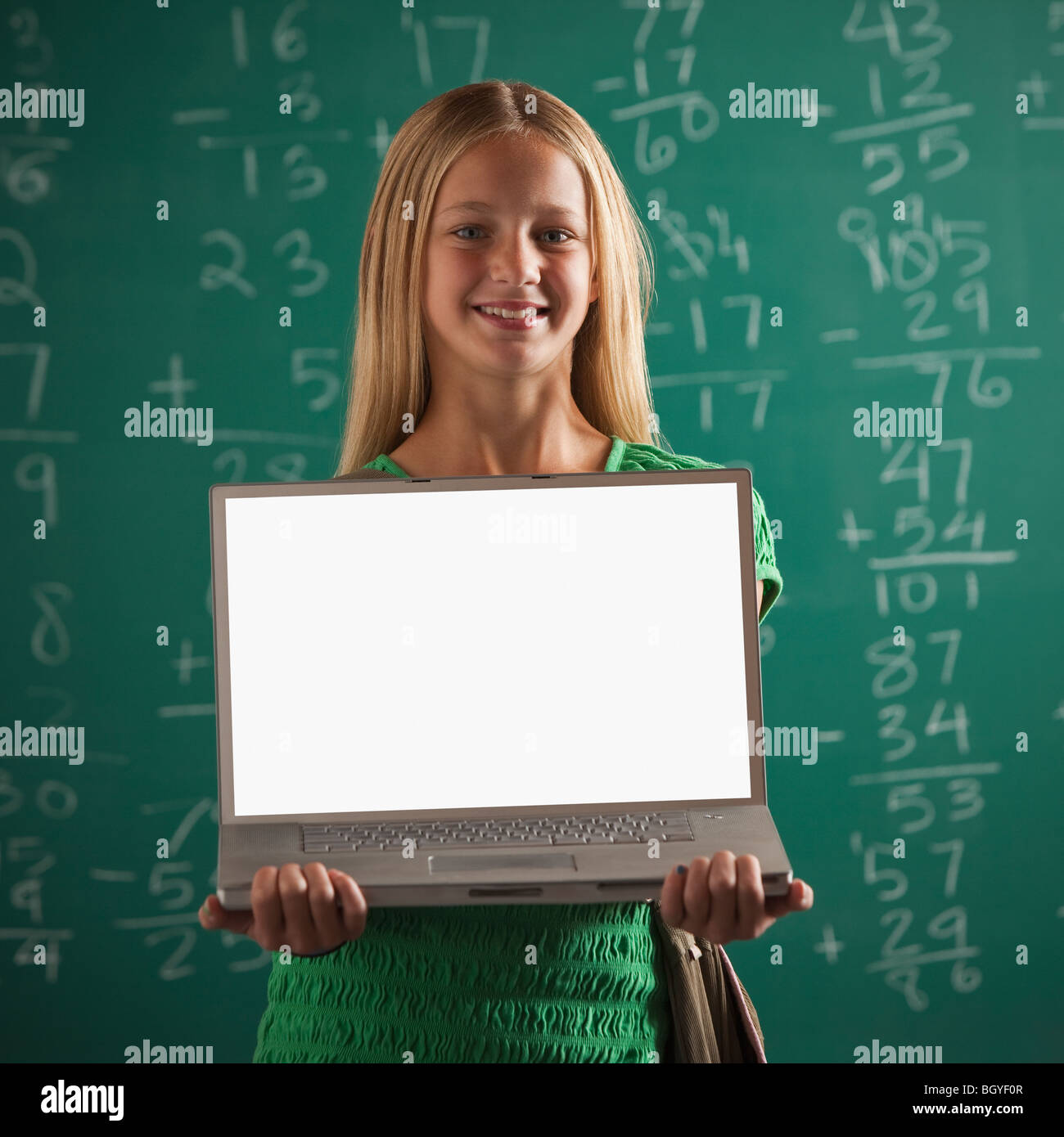 Student holding laptop Stock Photo - Alamy