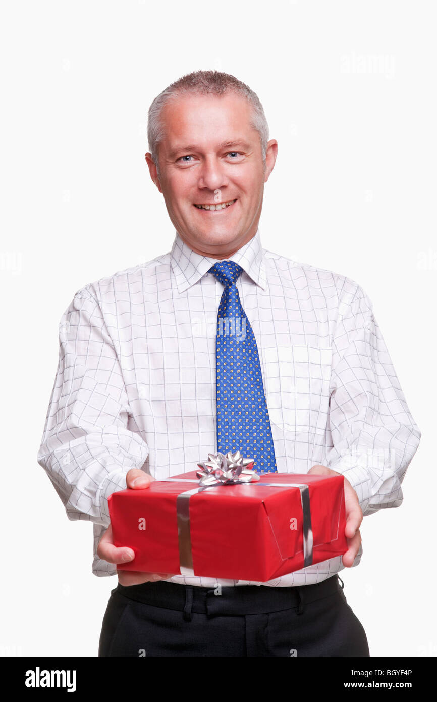 Man giving a present Stock Photo - Alamy