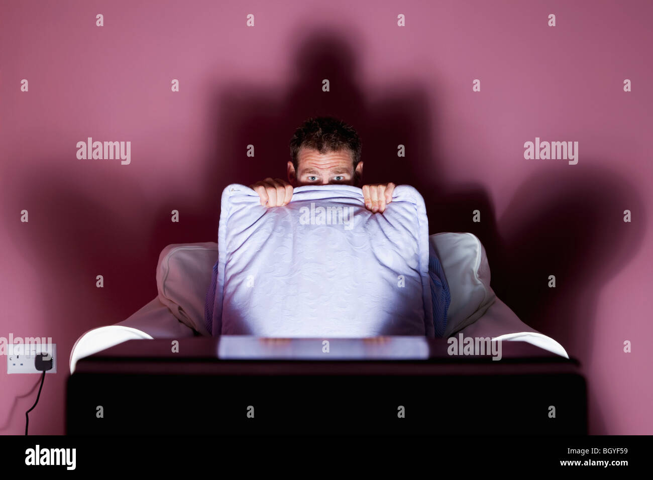 Man with frightened expression Stock Photo - Alamy