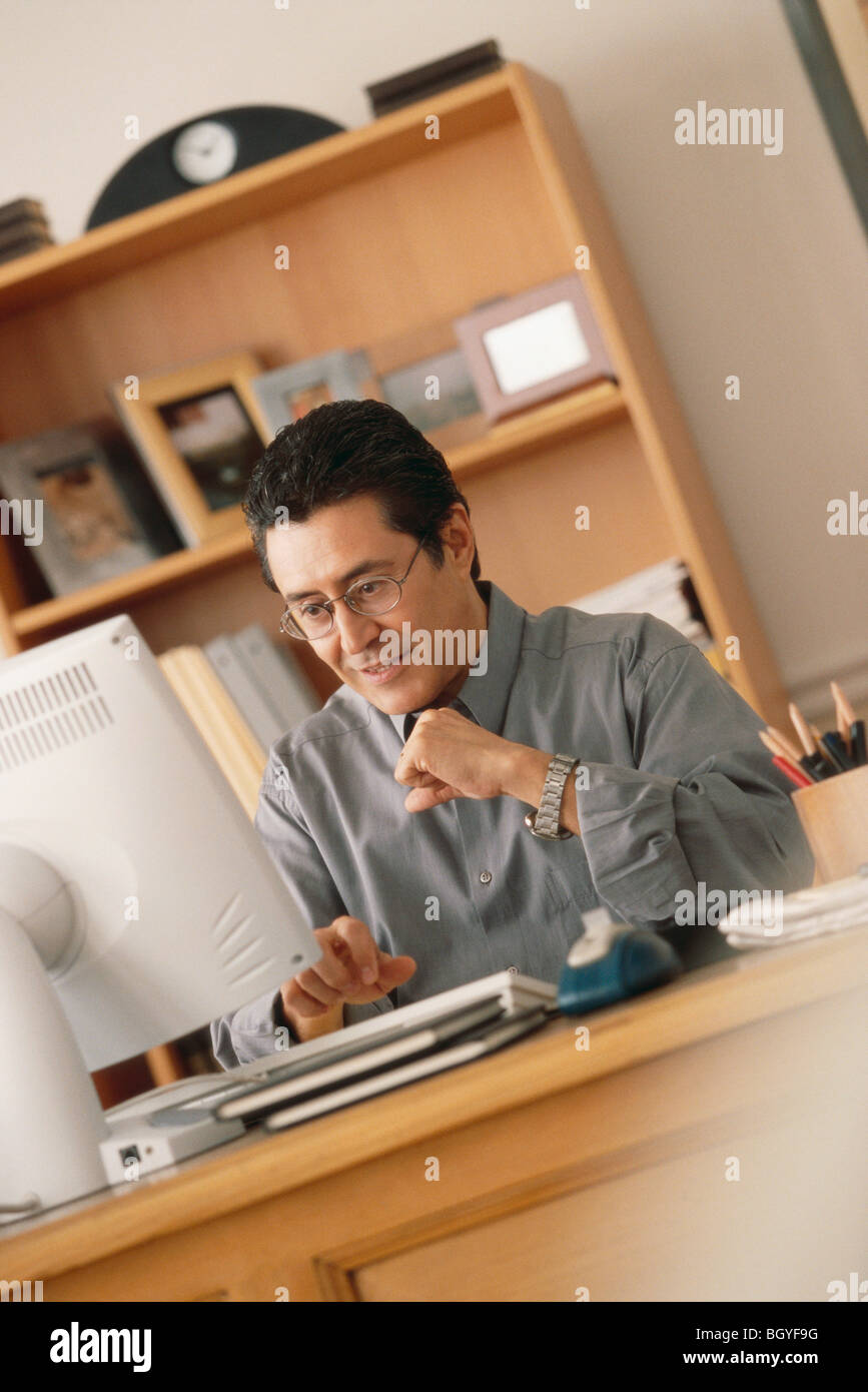 Man working at computer Stock Photo - Alamy