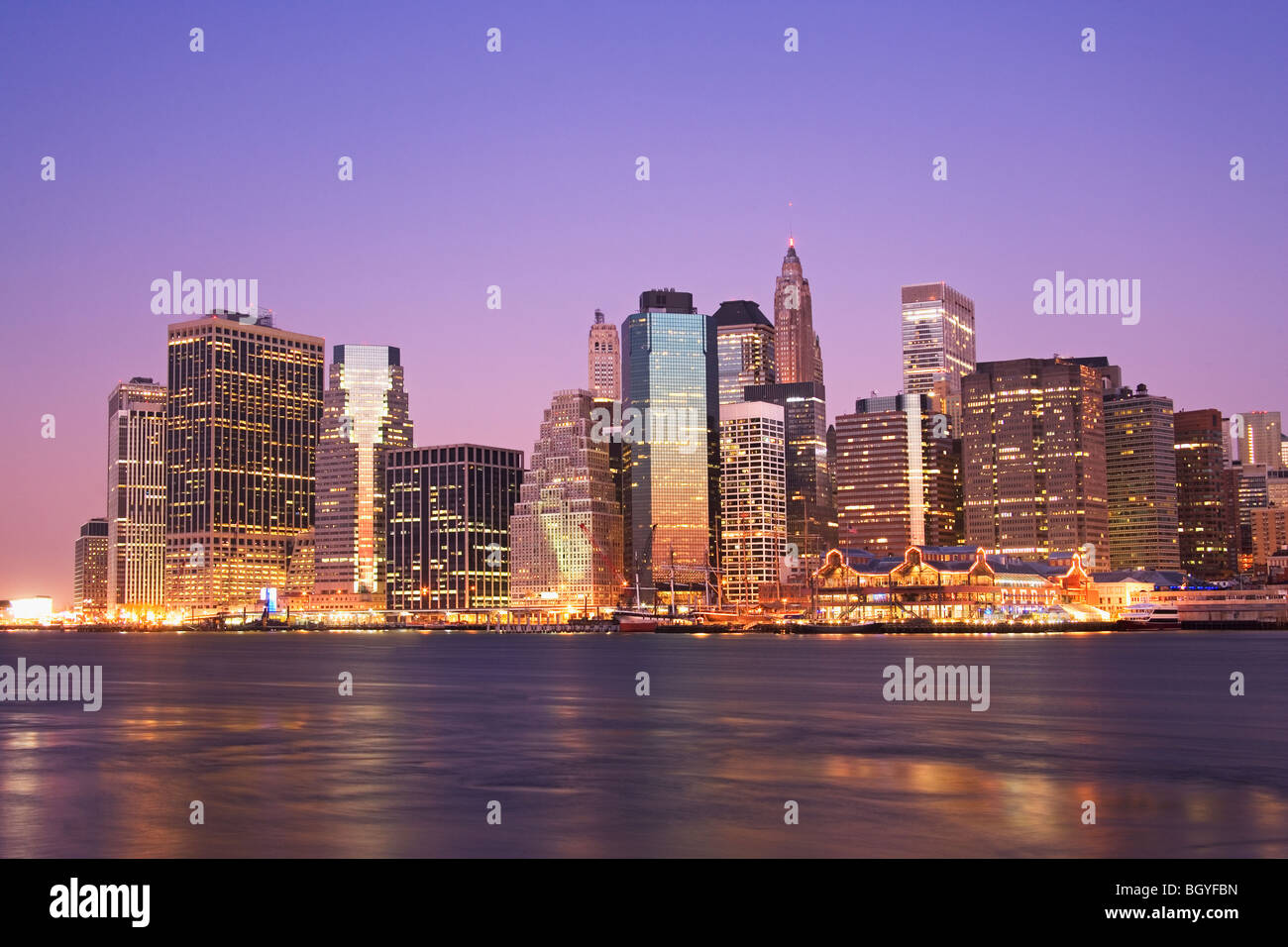 Illuminated waterfront office buildings Stock Photo - Alamy