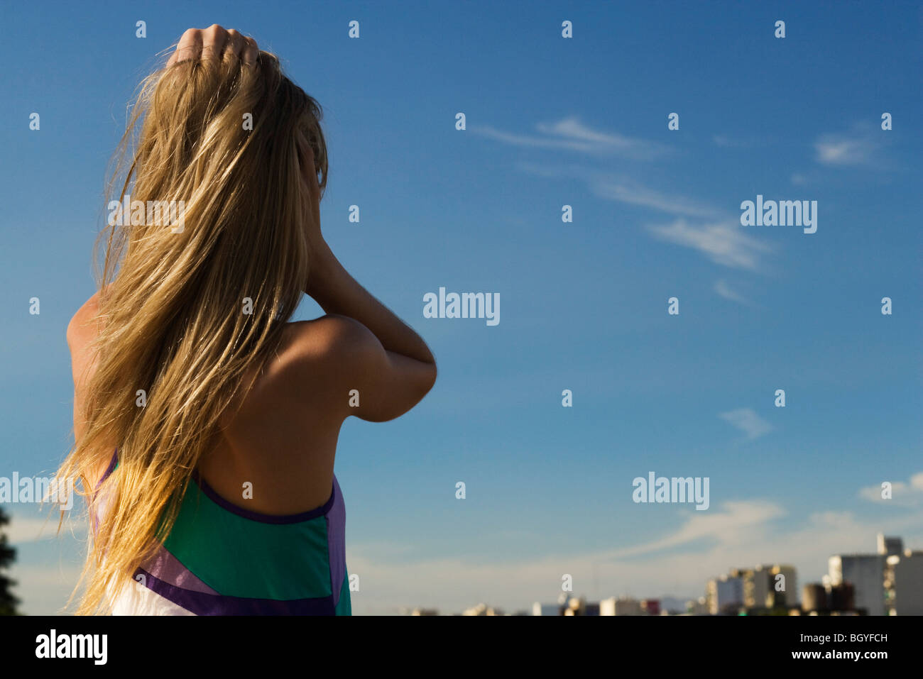 Blonde young woman looking distance hi-res stock photography and images ...