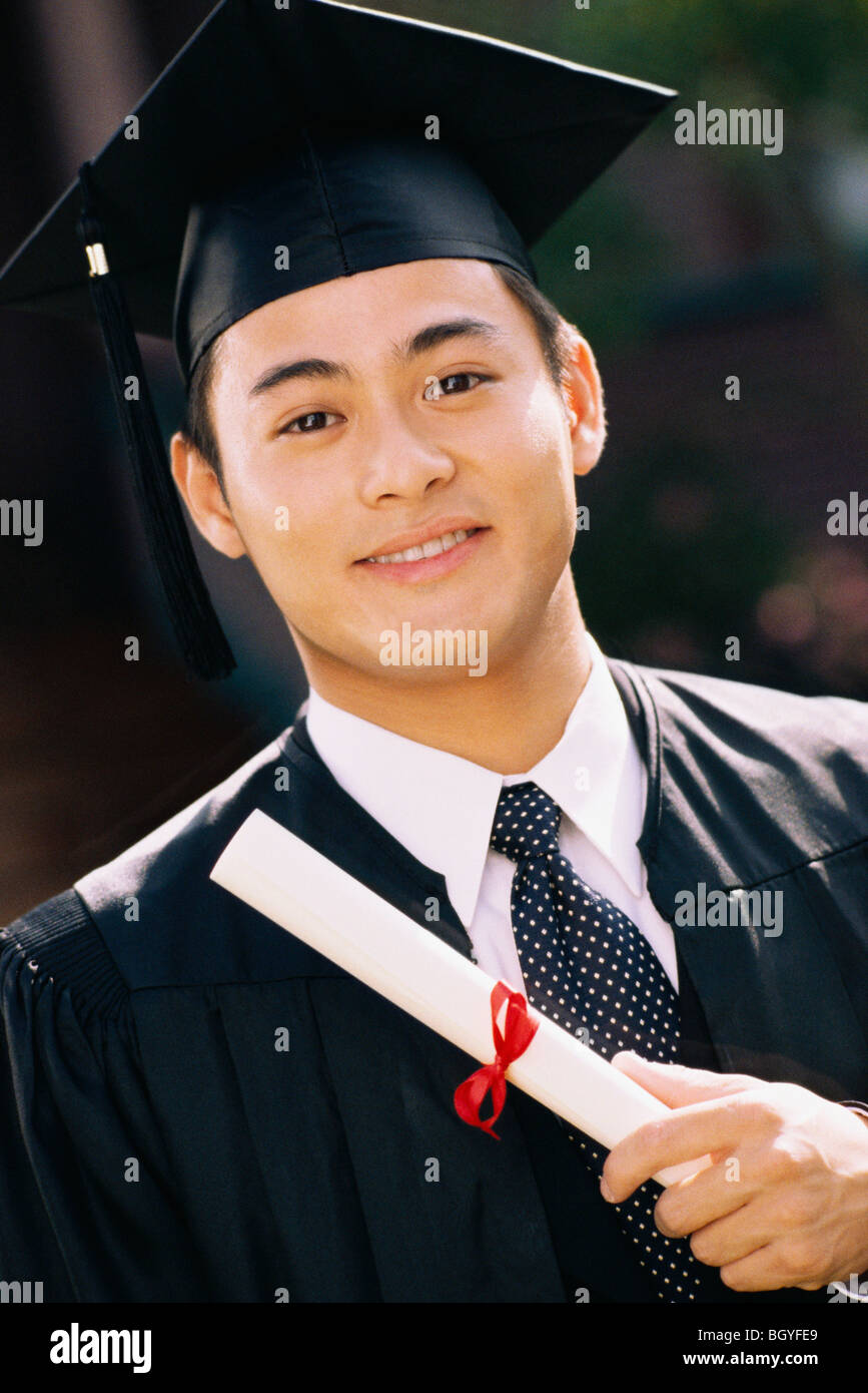 Graduate with diploma Stock Photo - Alamy