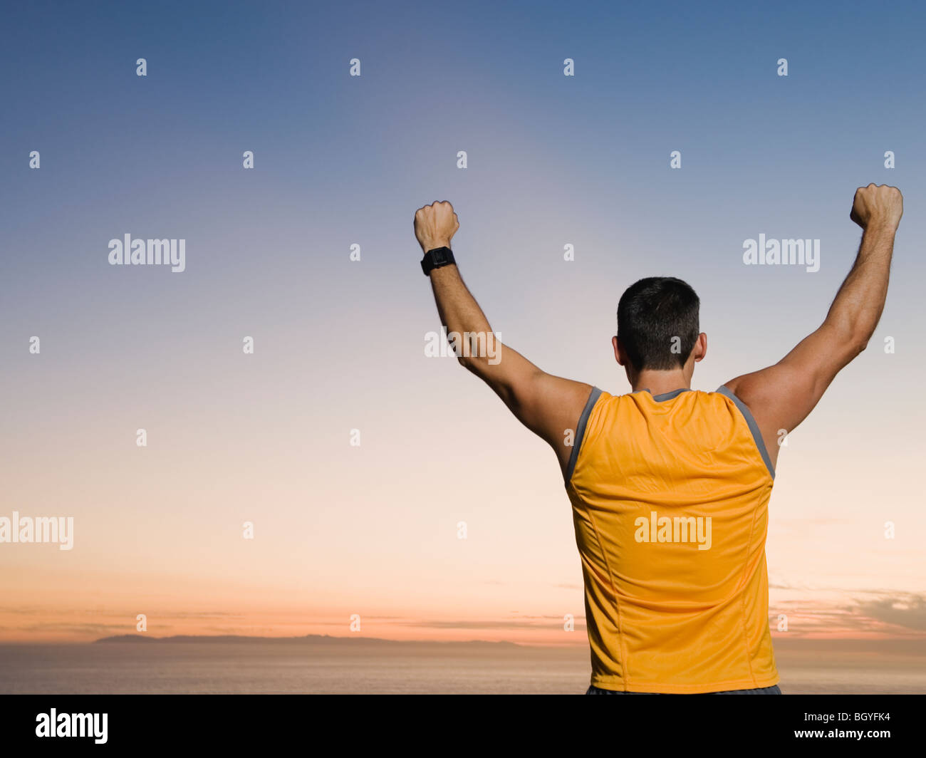 Man raising arms Stock Photo - Alamy