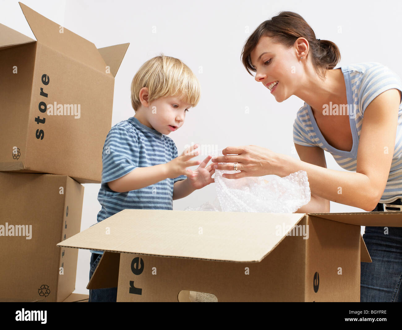 Child unpacking belongings in hi-res stock photography and images - Alamy