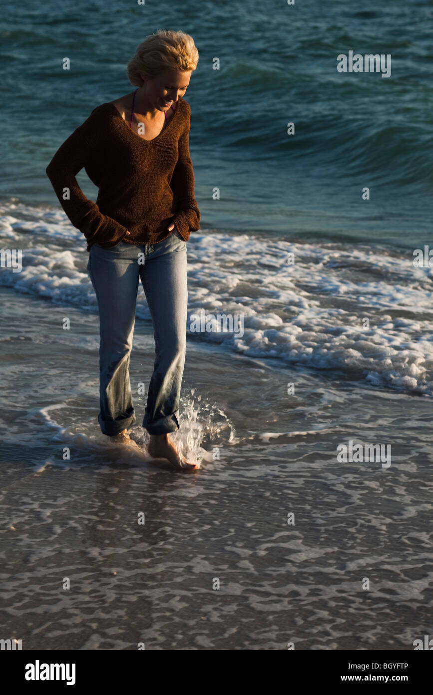 Woman strolling in surf hi-res stock photography and images - Alamy