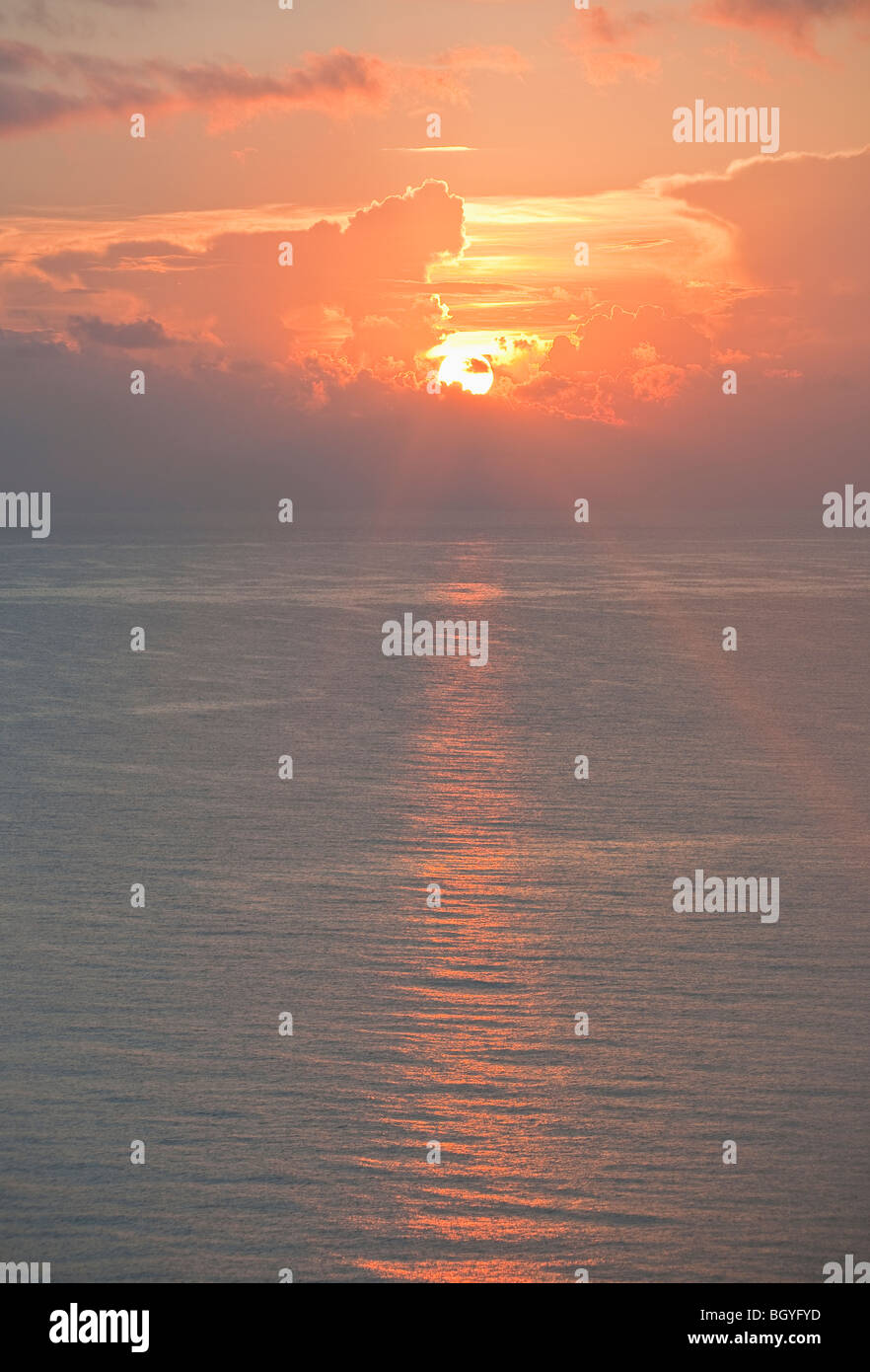 Sunset over ocean Stock Photo - Alamy