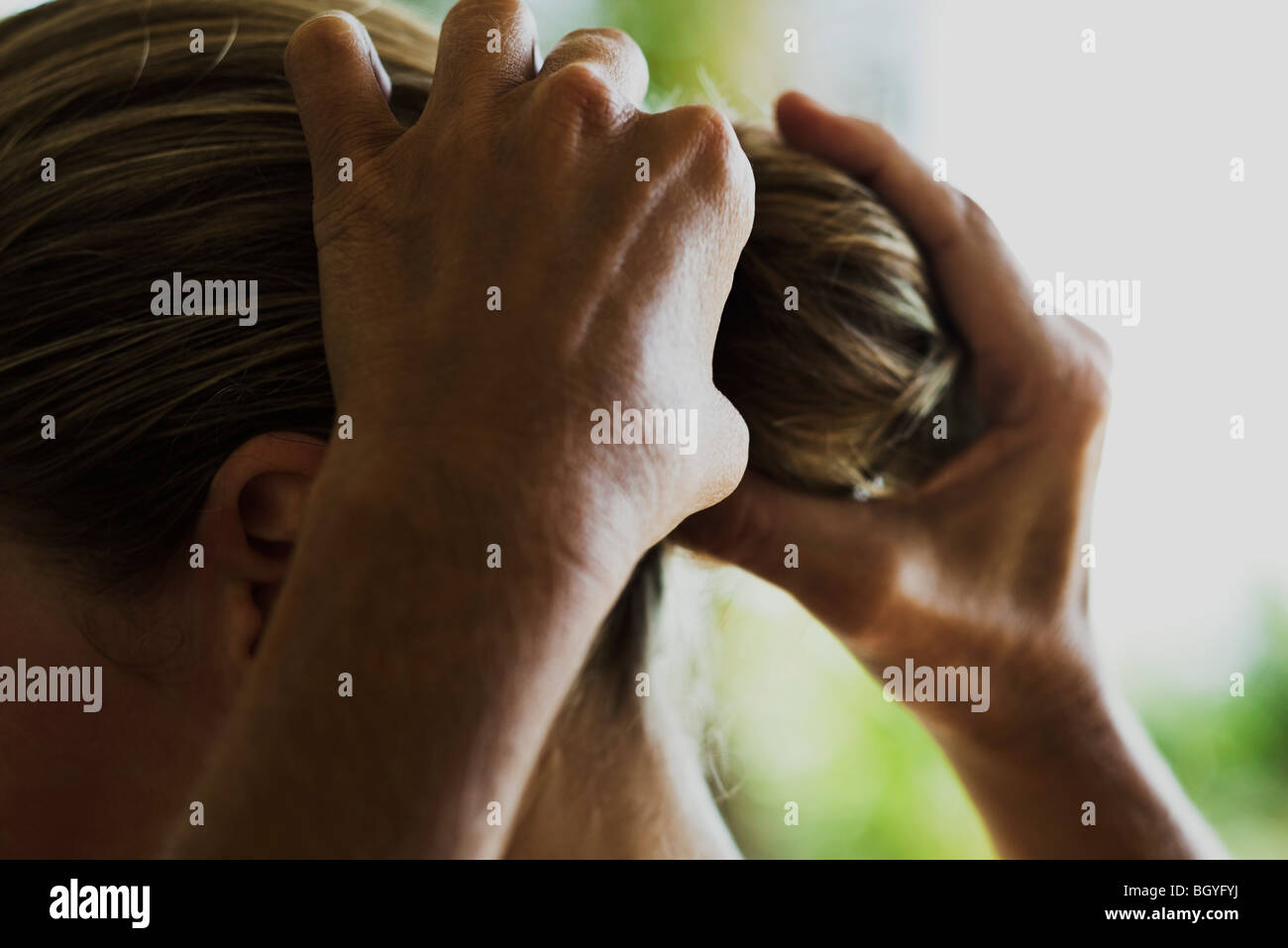 Person styling woman's hair, cropped Stock Photo - Alamy