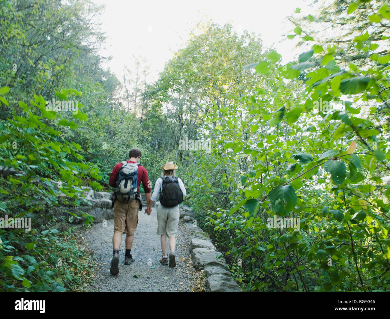 Female walking on stone pathway hi-res stock photography and images - Alamy