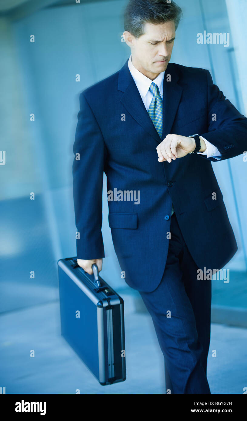 Businessman looking watch checking hi-res stock photography and images ...