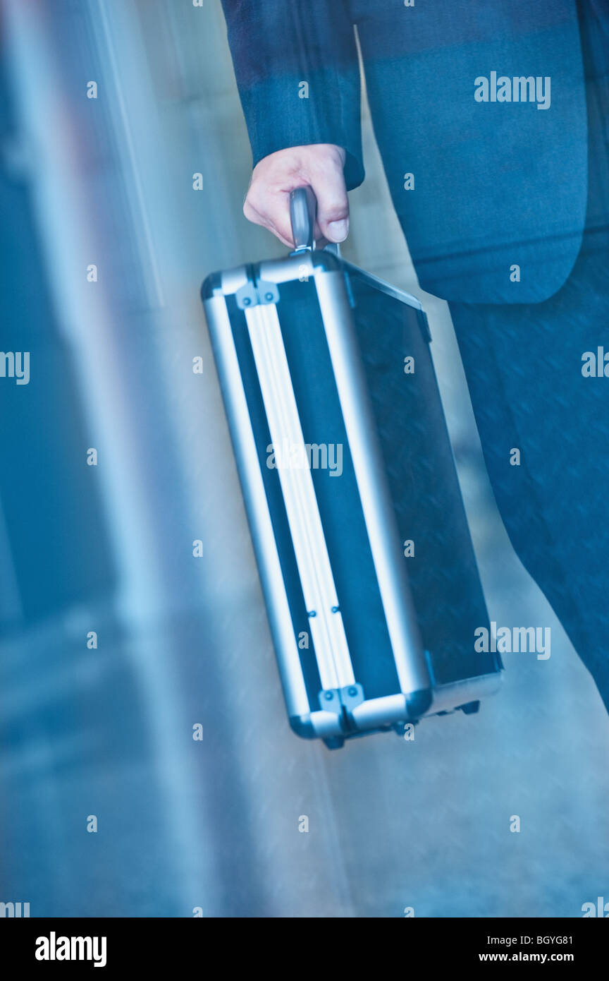 Hand holding briefcase hi-res stock photography and images - Alamy