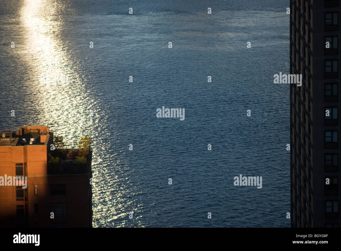High rise rooftop, open water in background Stock Photo - Alamy
