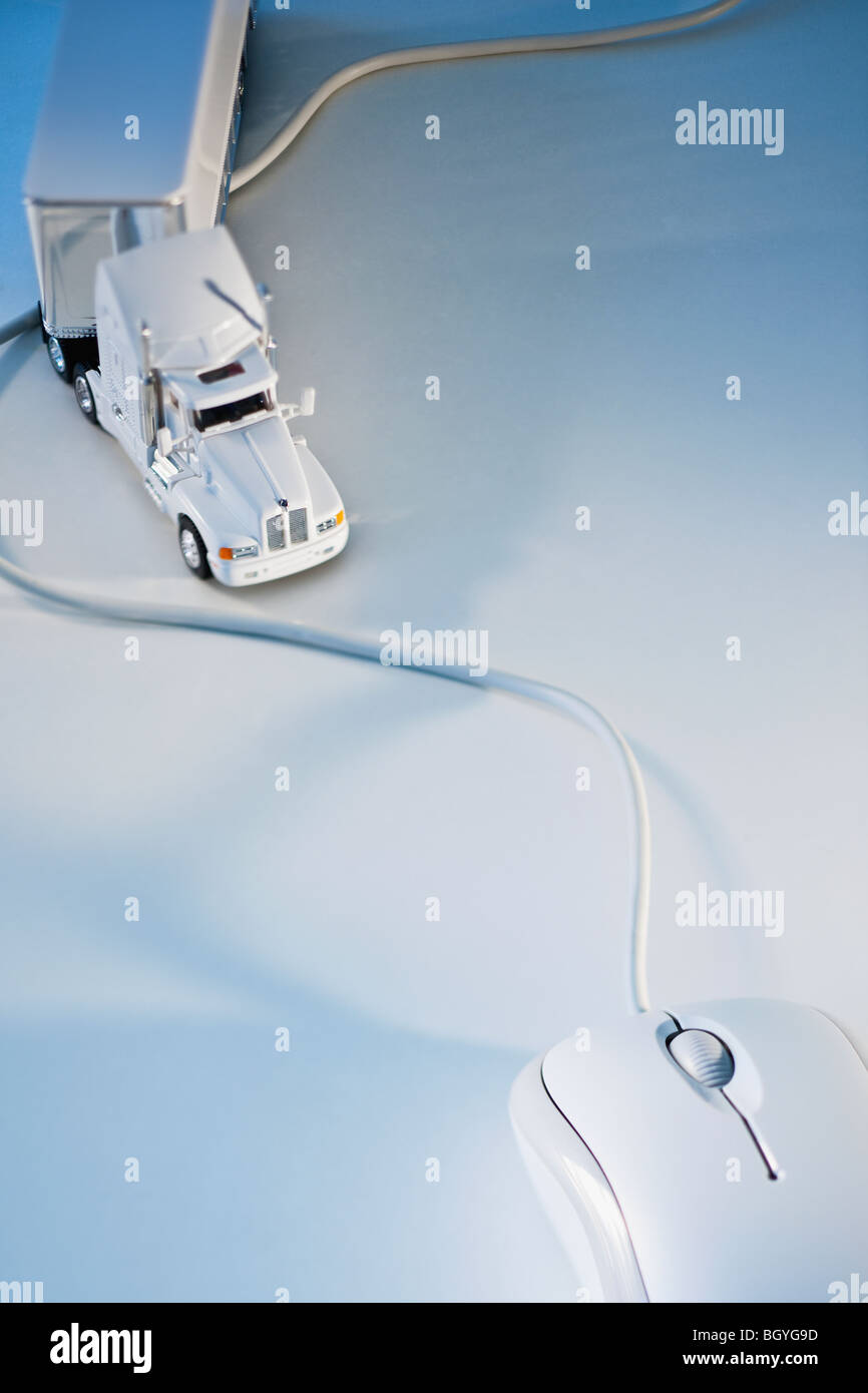 Computer mouse and toy truck Stock Photo - Alamy