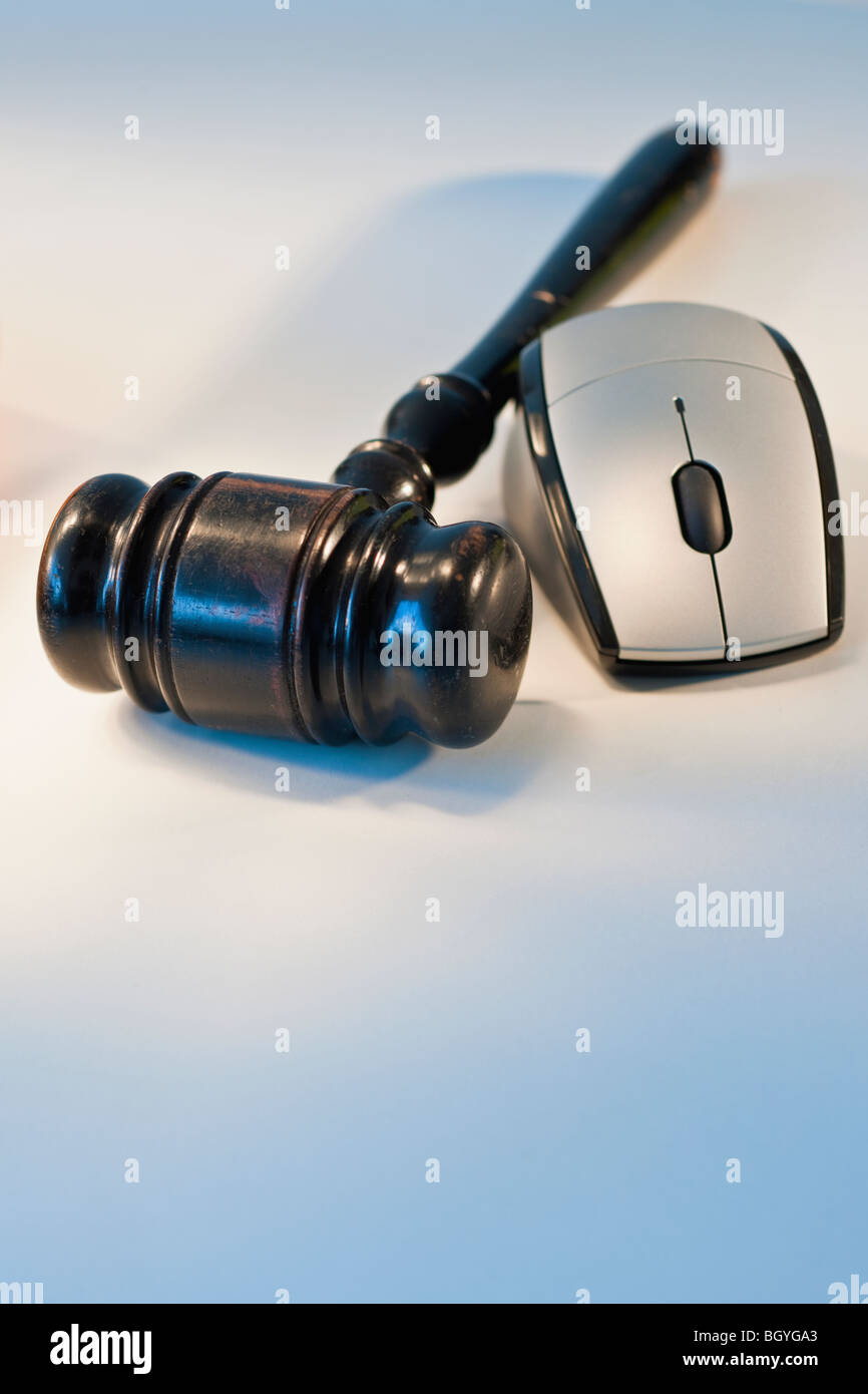 Computer mouse and gavel Stock Photo - Alamy