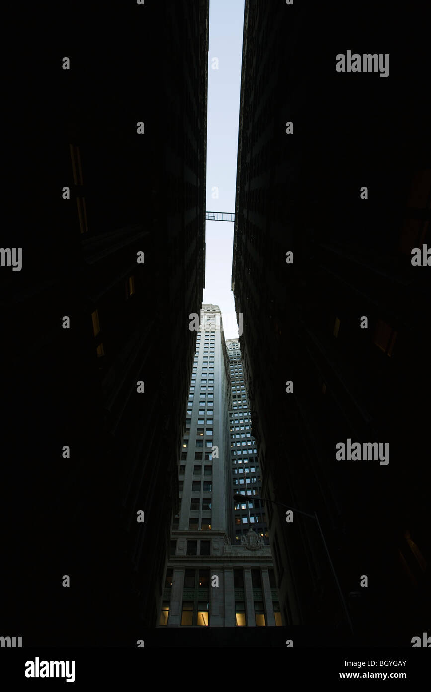 High rise seen at end of narrow alley, low angle view Stock Photo - Alamy