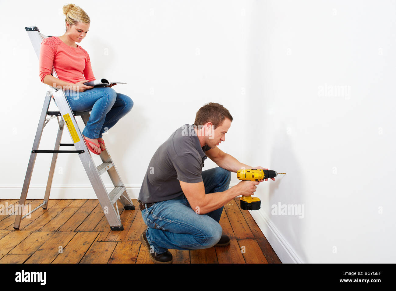 Couple doing DIY Stock Photo - Alamy