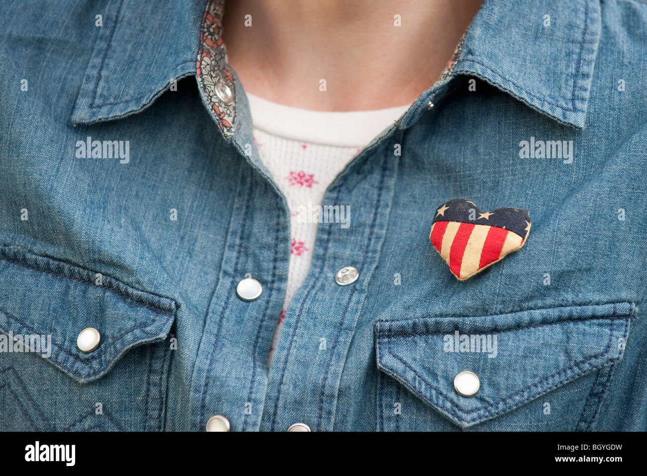 Woman wearing heart pin Stock Photo - Alamy