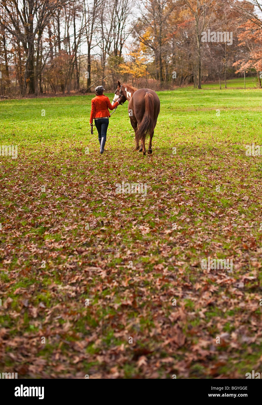 Horse walking woman hi-res stock photography and images - Alamy