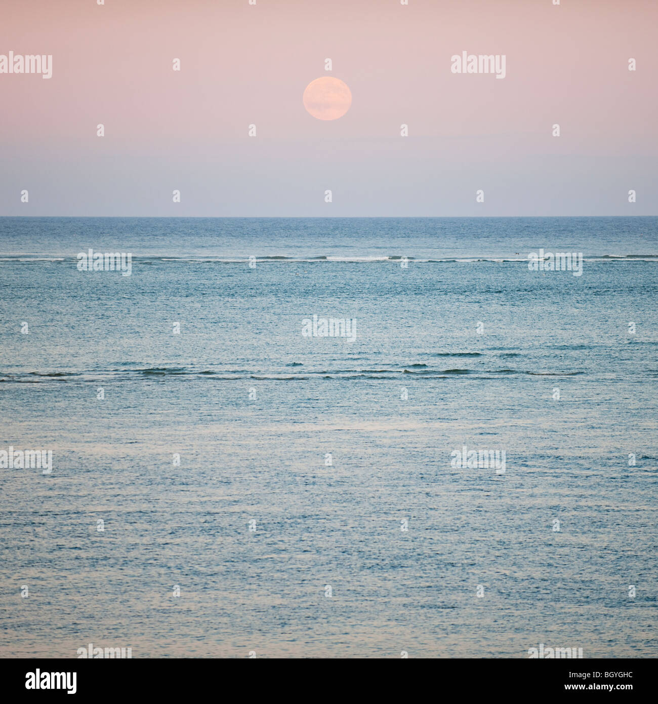 Moonrise over ocean Stock Photo - Alamy