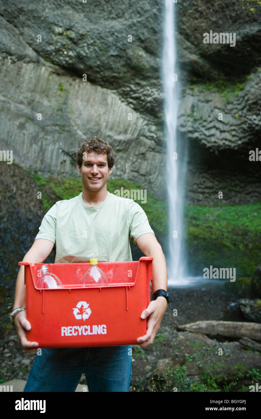 Man with recycling bin Stock Photo - Alamy