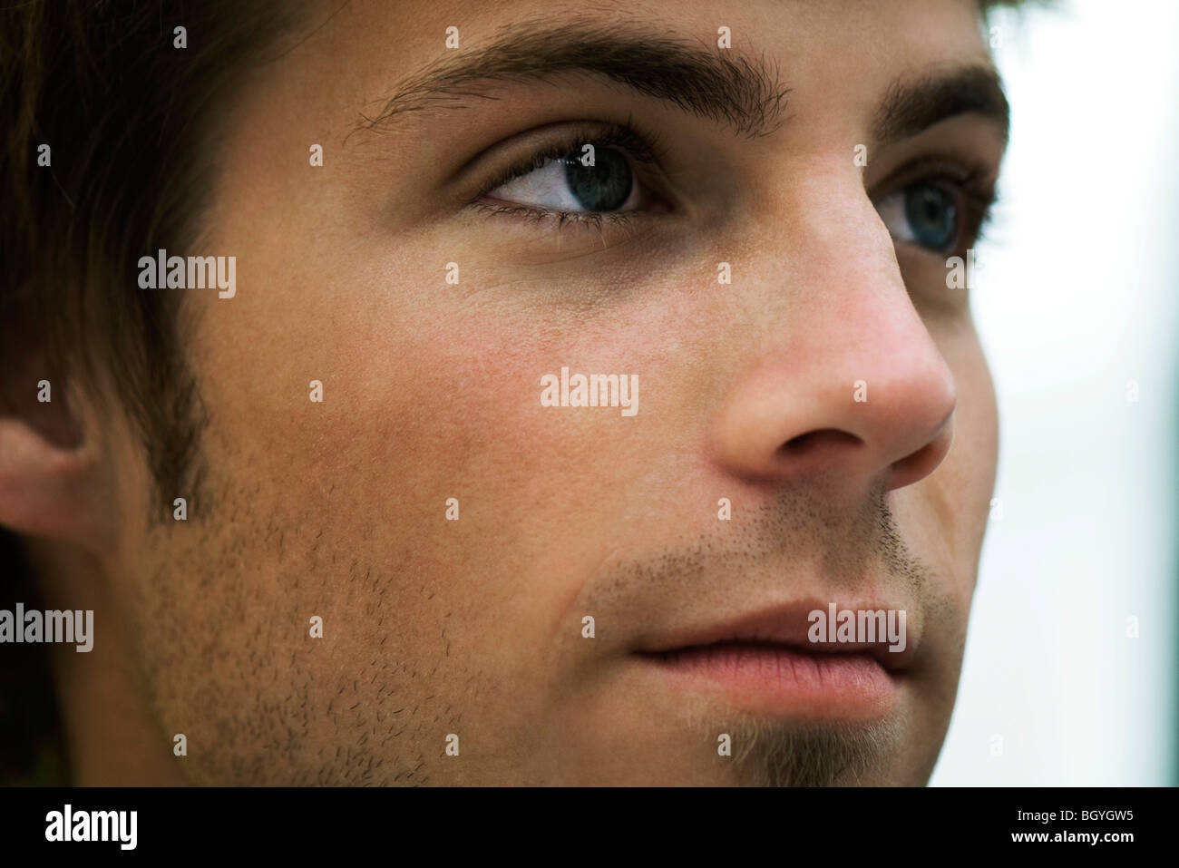 Man daydreaming, close-up Stock Photo - Alamy
