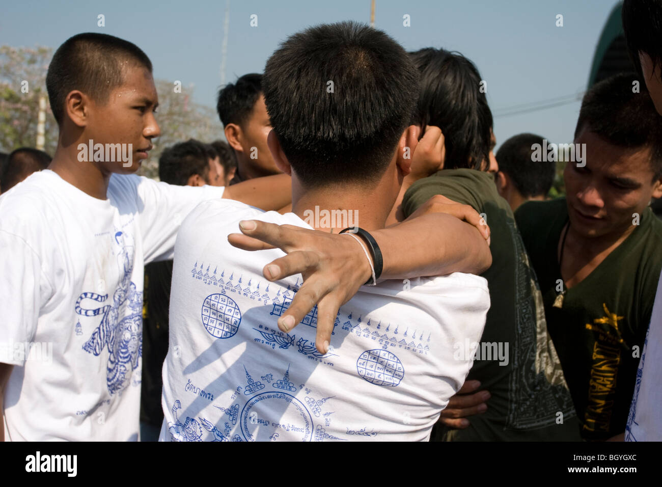 Attendants hold a tattooed devotee in trance at one of Thailand’s ...