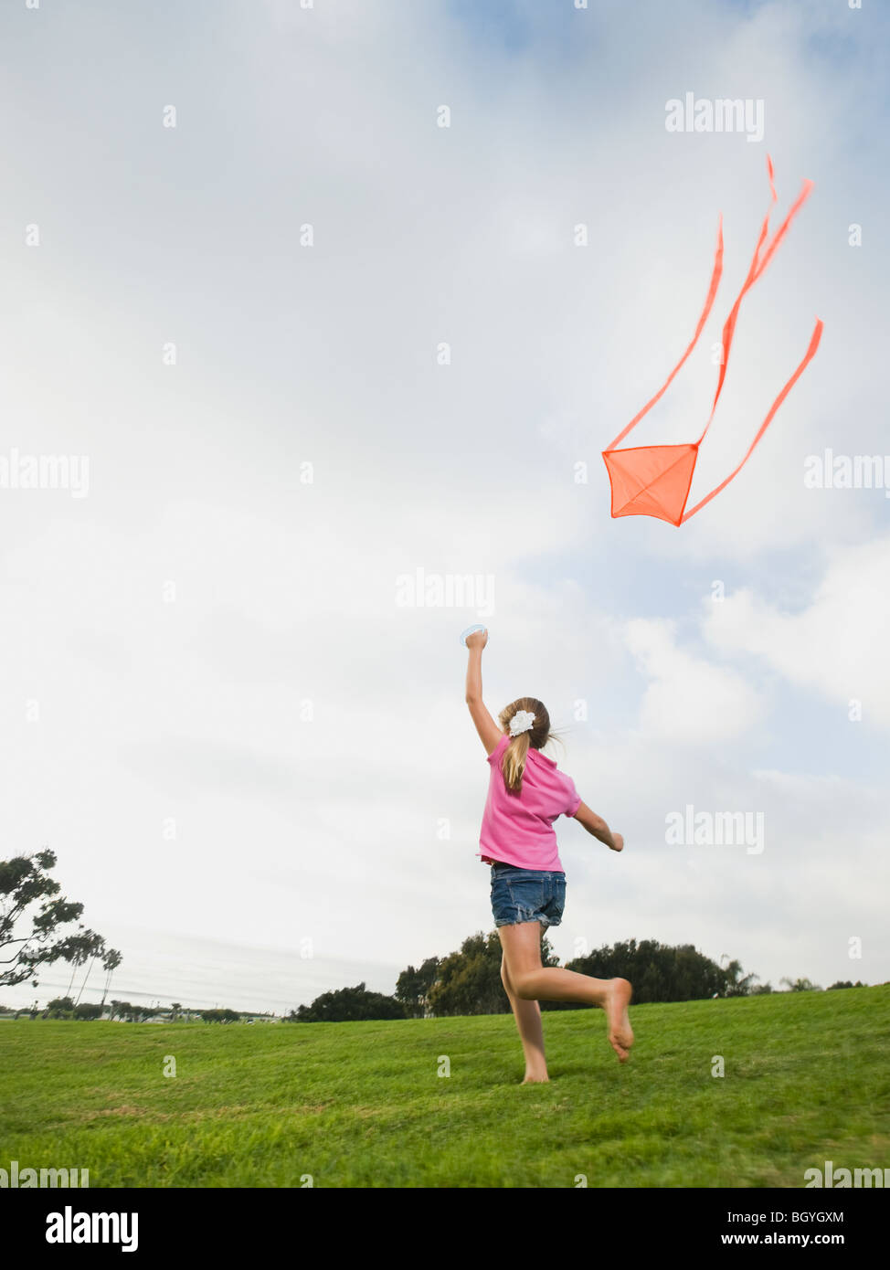 Girl flying a kite hi-res stock photography and images - Alamy