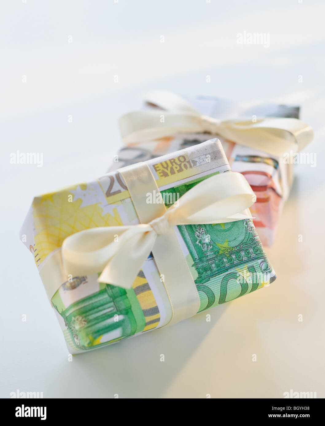 Gifts wrapped in money Stock Photo - Alamy
