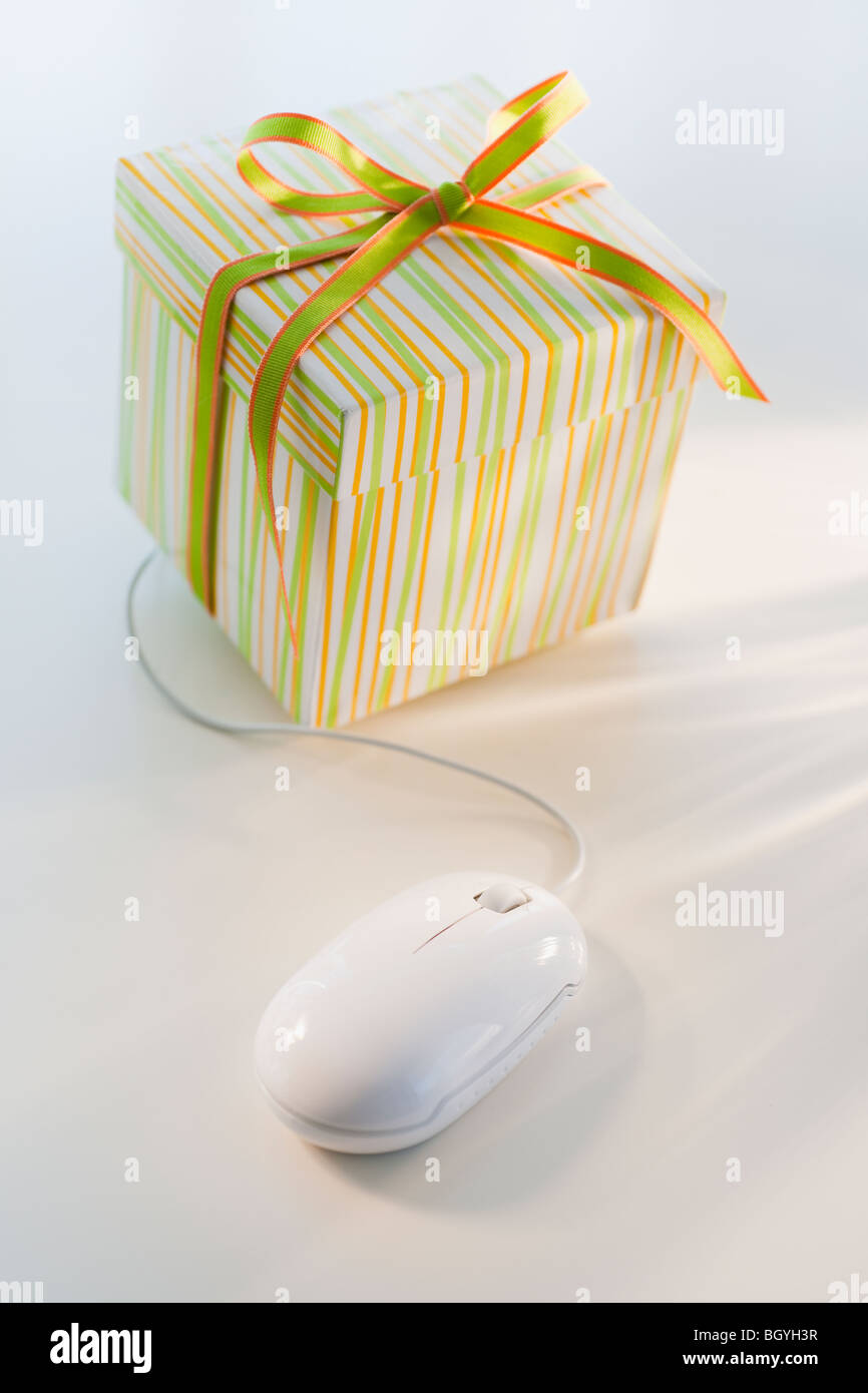Gift and computer mouse Stock Photo - Alamy