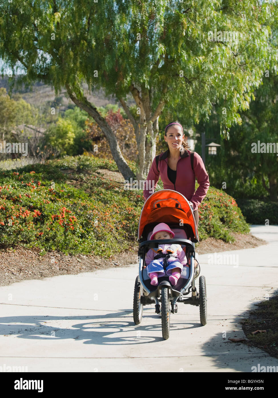 Woman running baby stroller in hi-res stock photography and images - Alamy