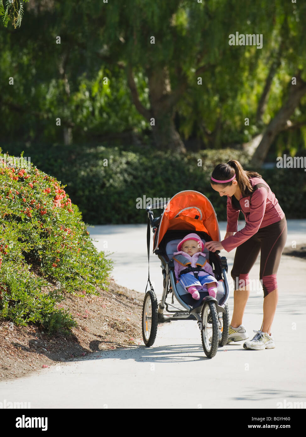 Woman and stroller Stock Photo - Alamy