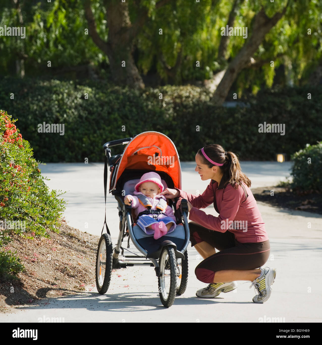 Woman and stroller Stock Photo - Alamy