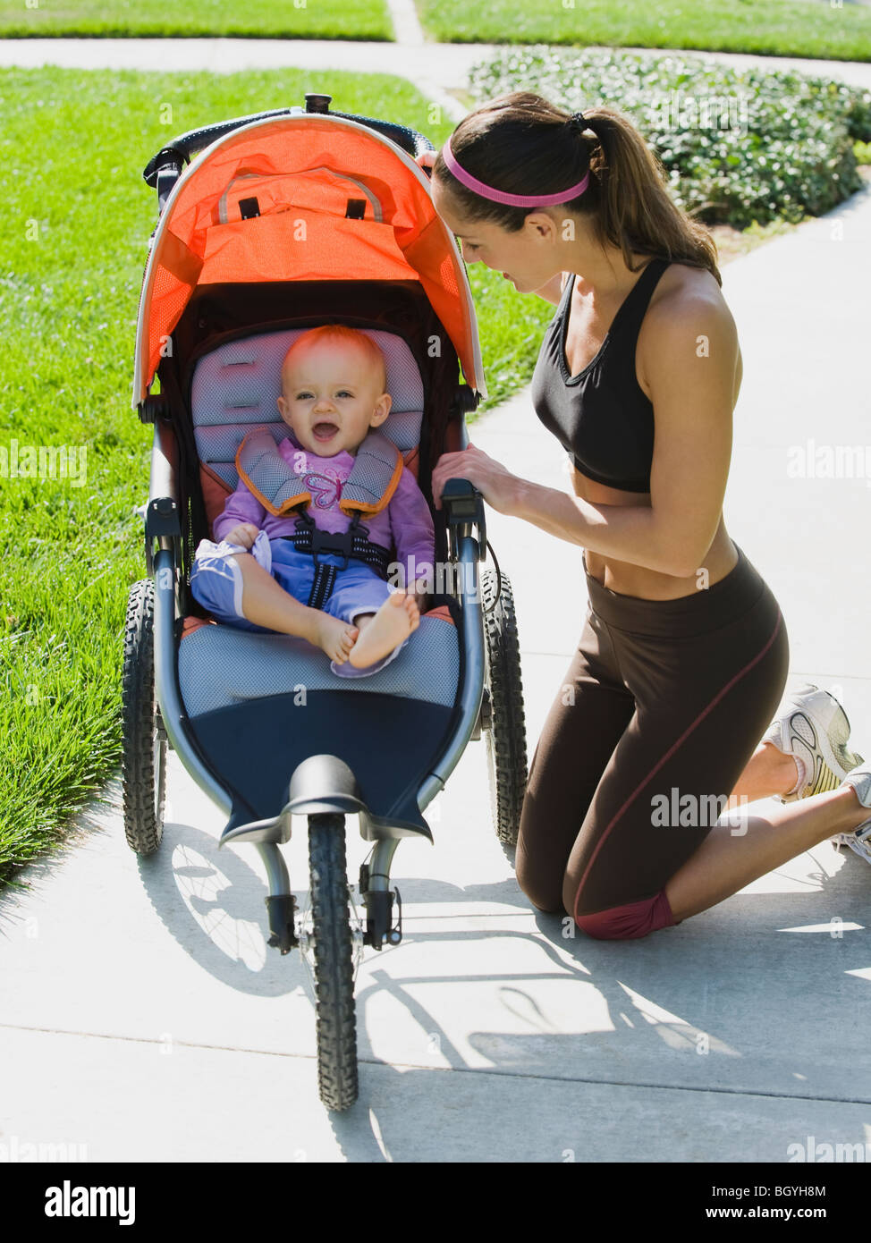 Jogger and baby Stock Photo - Alamy