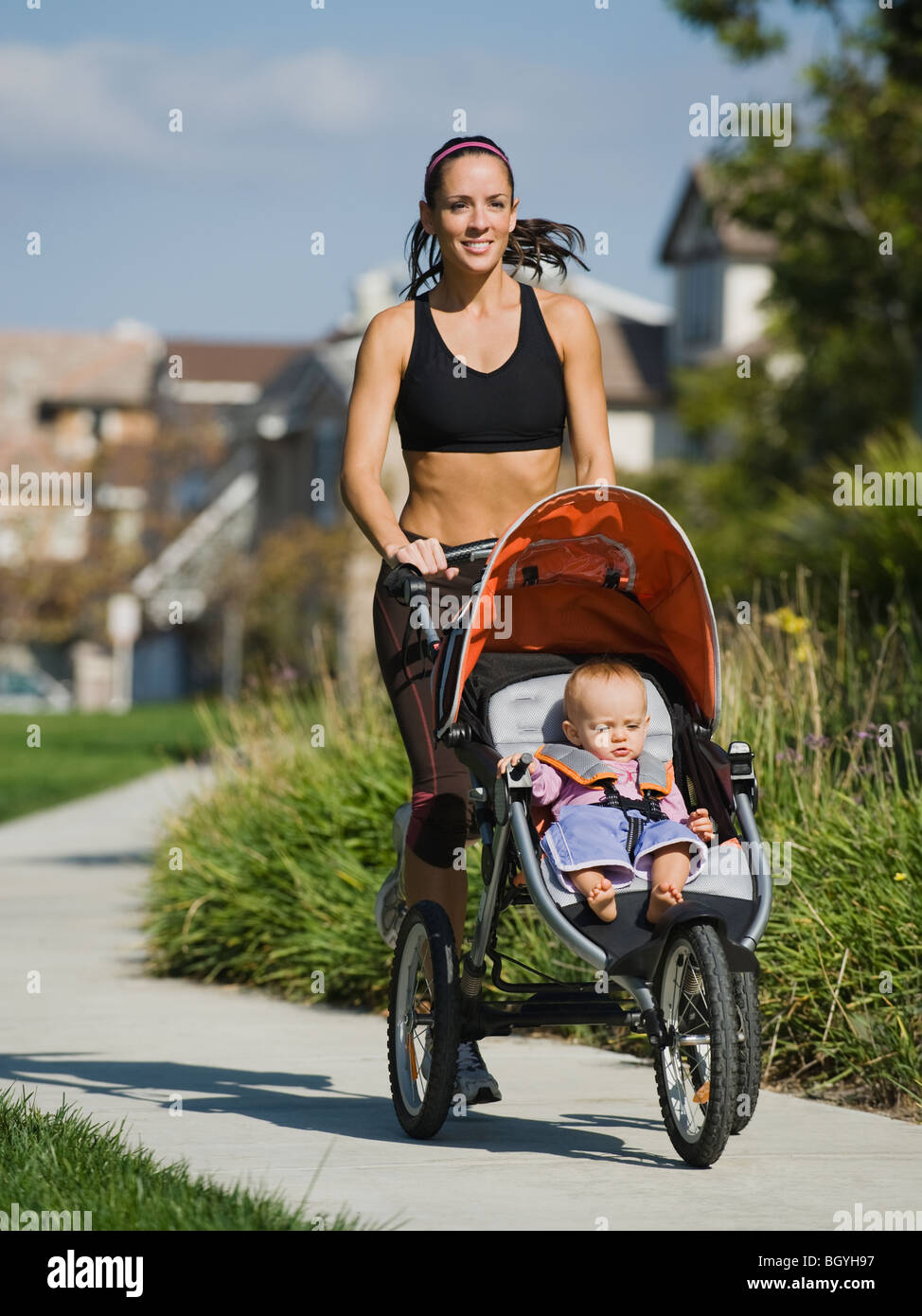 Jogger and baby Stock Photo - Alamy
