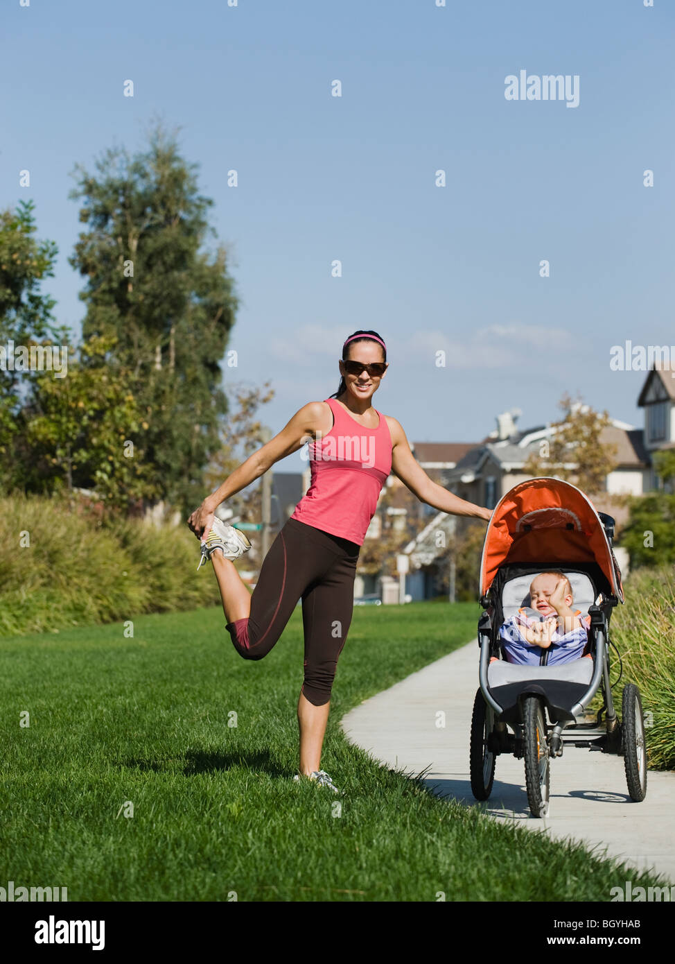 Jogger and baby Stock Photo - Alamy