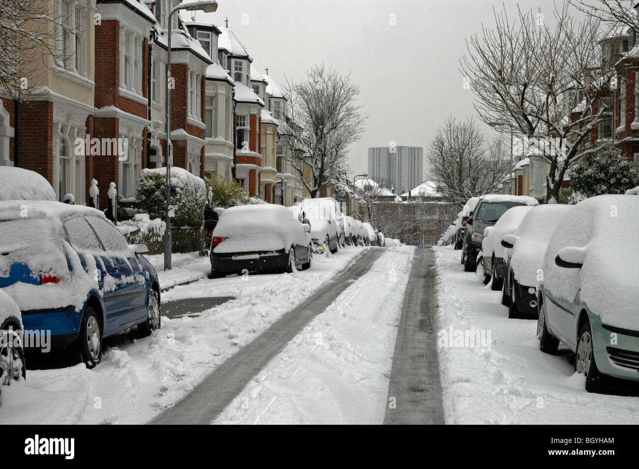 Urban side street in the snow Stock Photo - Alamy