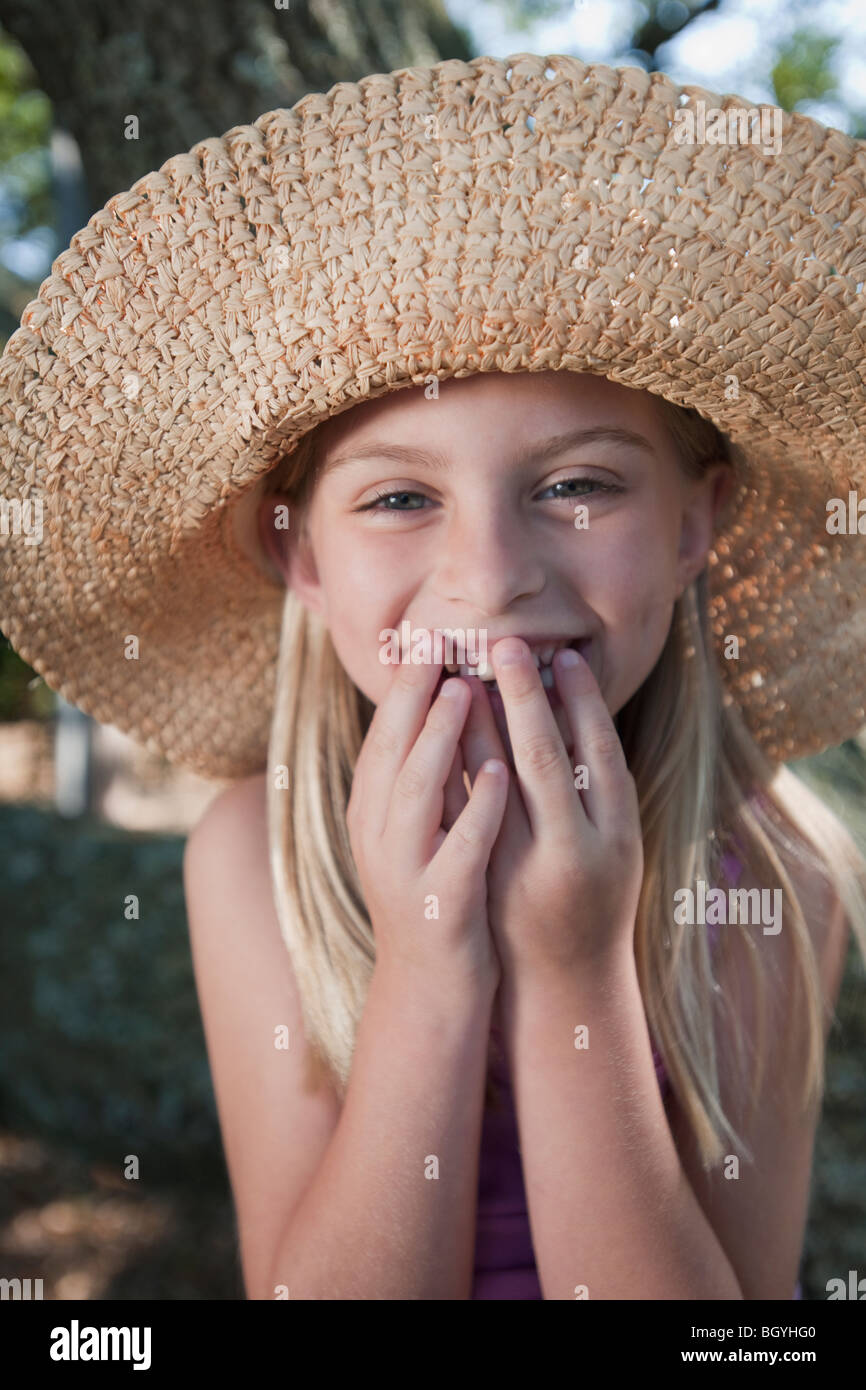 Girl wearing straw hat Stock Photo - Alamy