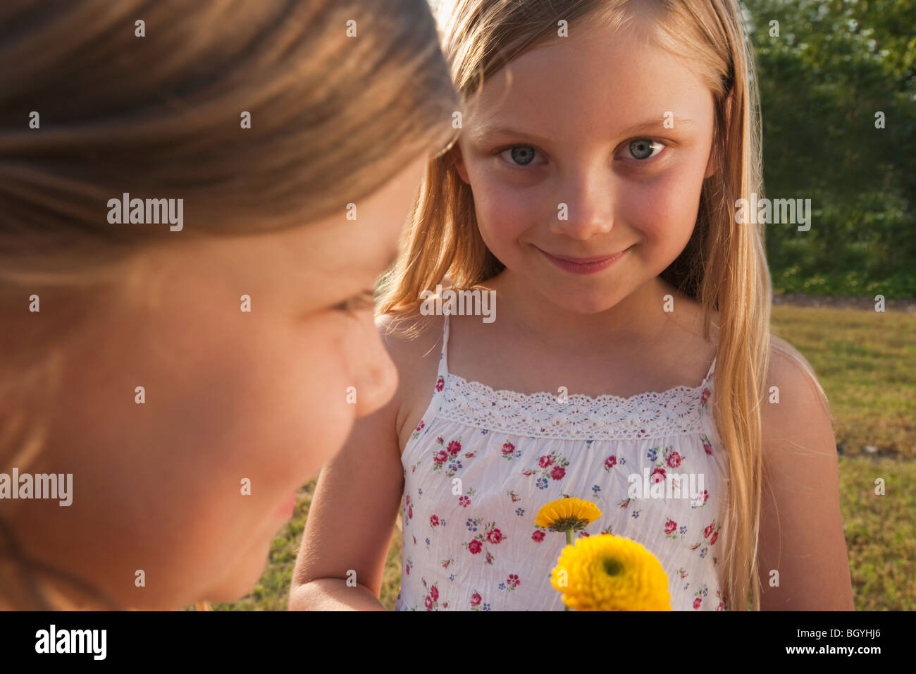 Young girls smiling Stock Photo - Alamy