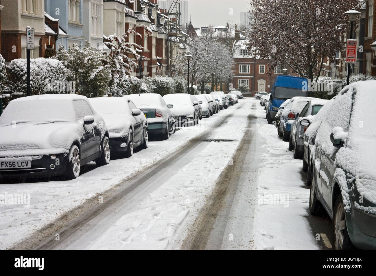Urban side street in the snow Stock Photo - Alamy