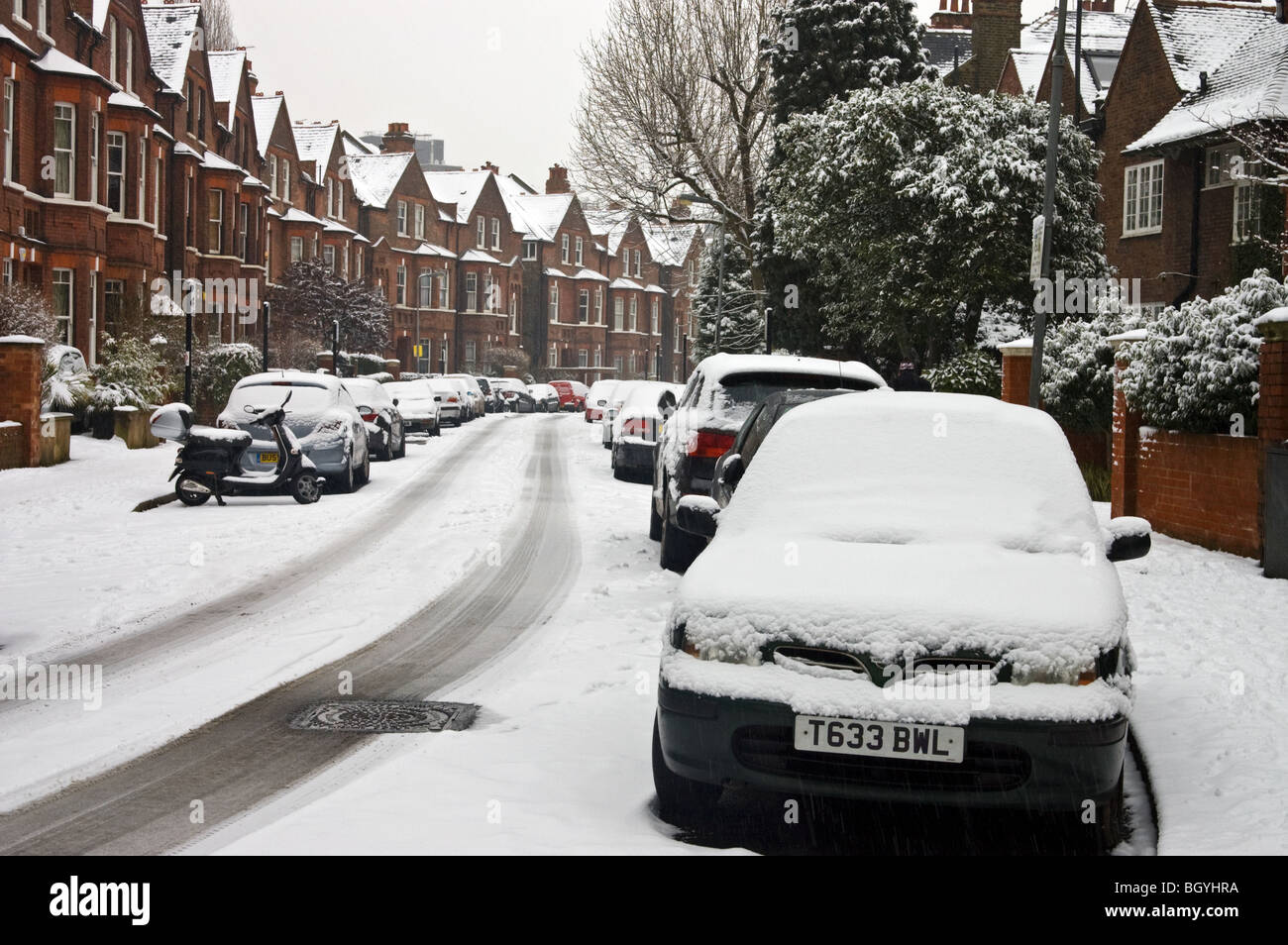 Urban side street in the snow Stock Photo - Alamy