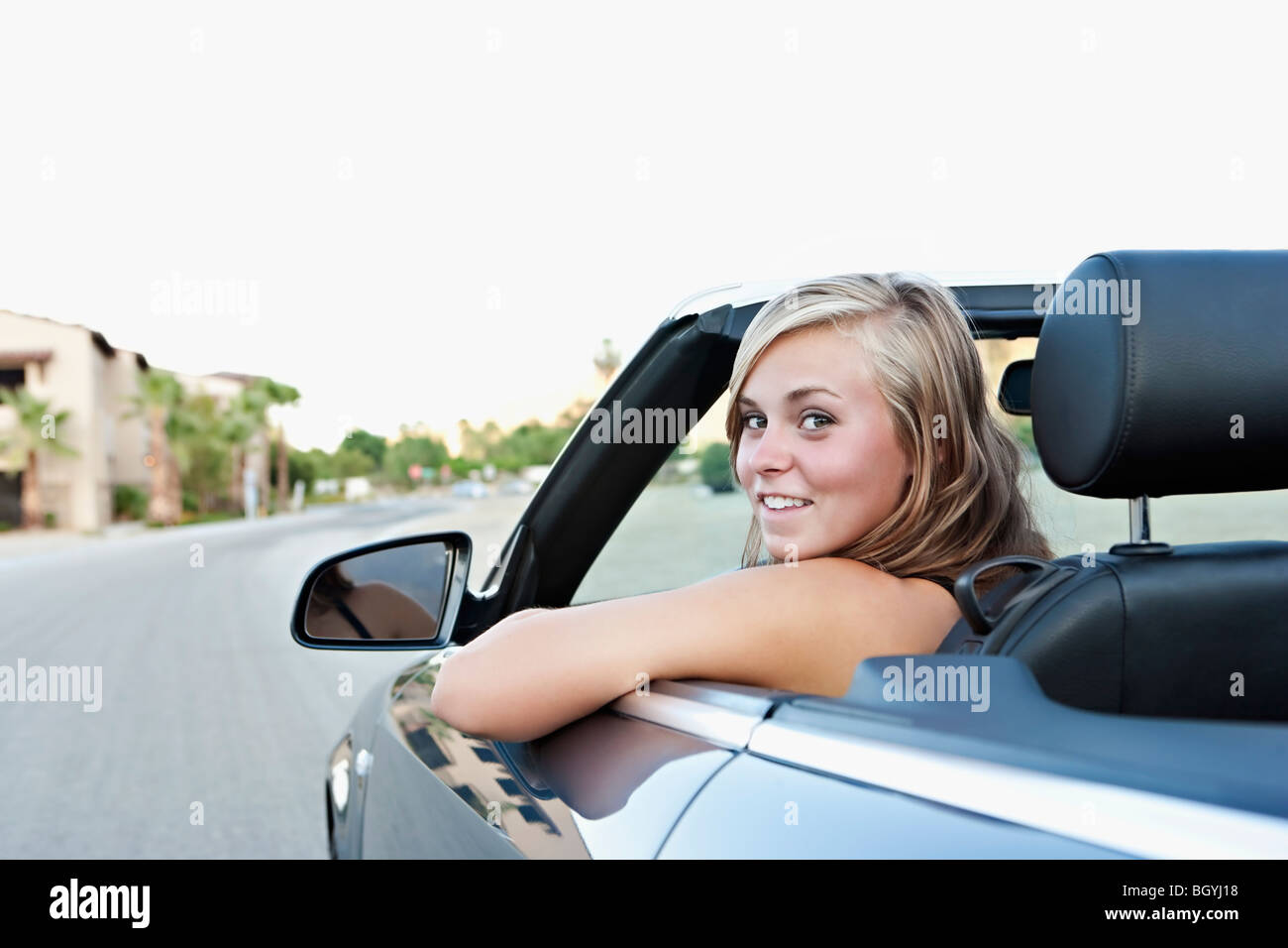 Woman driving convertible Stock Photo - Alamy