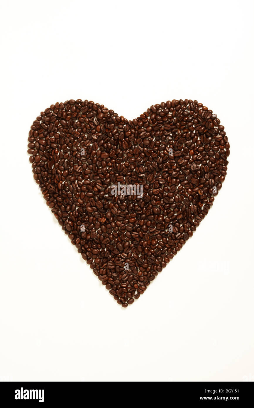 Coffee Beans Foaming a Heart Shape Symbolizing Love Stock Photo - Alamy