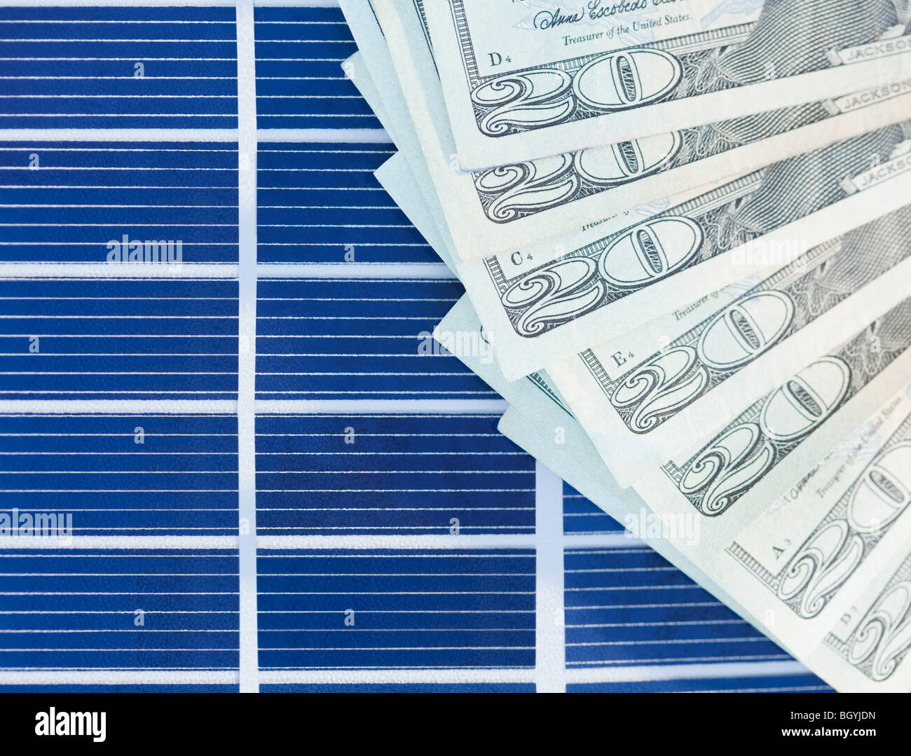 Money on solar panels Stock Photo - Alamy