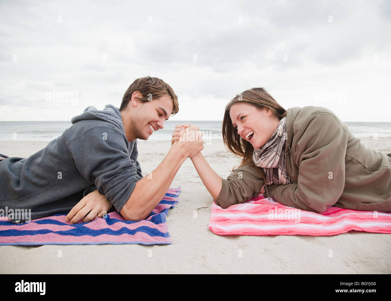 Couple arm wrestling Stock Photo - Alamy