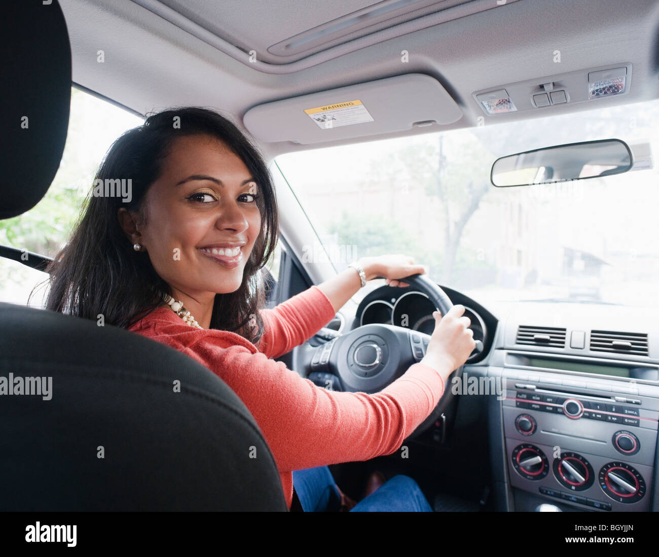 Woman driving car Stock Photo - Alamy