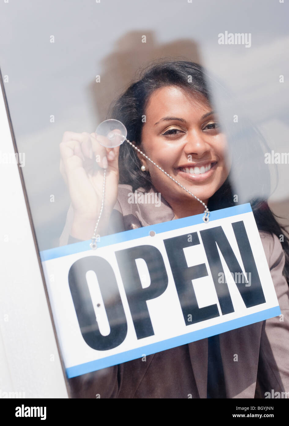 Young woman signs window hi-res stock photography and images - Alamy